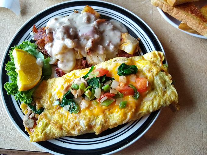 This ham and cheese omelet isn't just breakfast; it's a fluffy golden envelope stuffed with promises of a better day ahead.