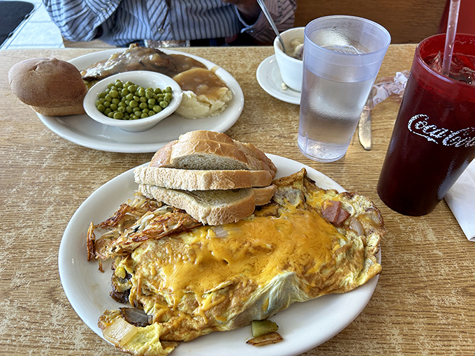 This omelet isn't messing around—packed with fillings and served with toast substantial enough to handle whatever breakfast mission you assign it.