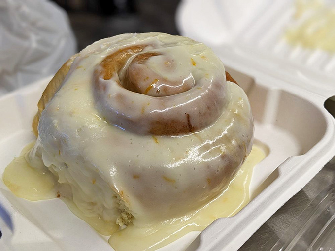 The orange zest cinnamon roll glistens with frosting like morning dew on a perfect flower. This isn't breakfast; it's edible therapy.