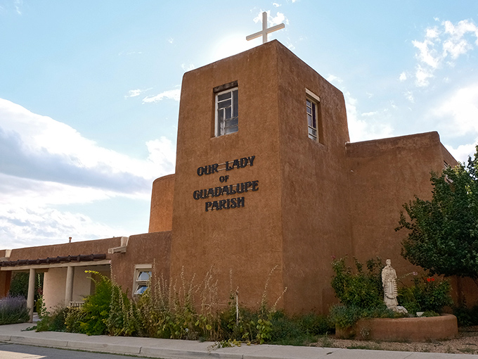 Our Lady of Guadalupe Parish stands as a testament to faith and adobe craftsmanship. The stark blue sky makes that cross pop like divine punctuation. 