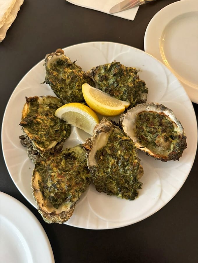 Oysters Rockefeller: where spinach finally gets the glamorous makeover it deserves, perched atop briny treasures from the deep.
