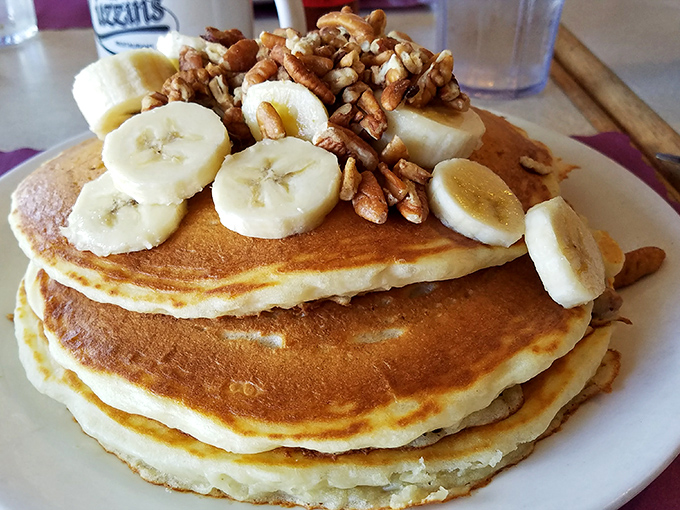 Pancake perfection doesn't need to be complicated. Golden discs topped with fresh bananas and pecans&mdash;simple pleasures that make mornings worth facing.