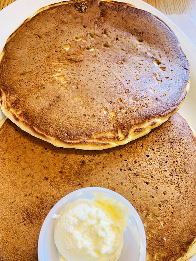 Pancakes so perfectly golden they deserve their own Instagram account, with butter melting like a summer sunset on a Wisconsin lake.