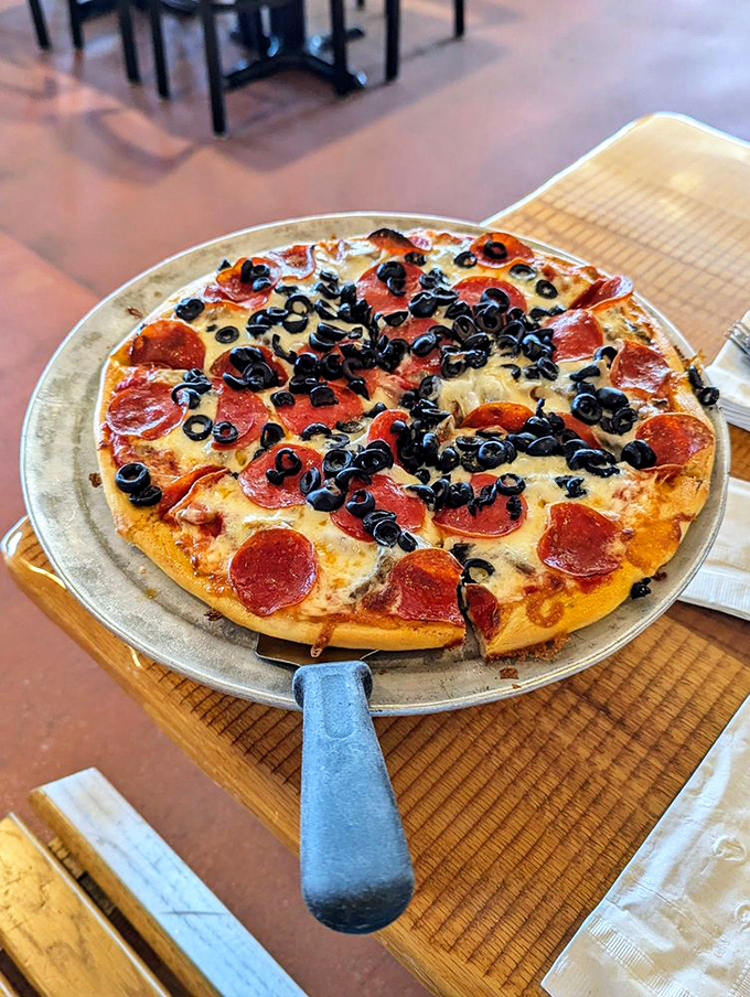 This pepperoni and olive pizza isn't just food&mdash;it's edible artwork where each black olive stands guard over islands of perfectly crisped pepperoni.
