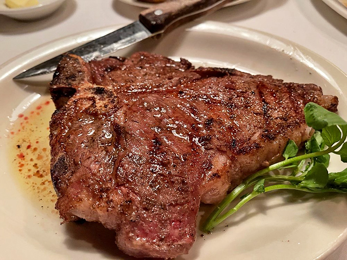 The porterhouse arrives like a meaty masterpiece &ndash; a beautiful crust giving way to a rosy interior. This isn't just dinner; it's a reminder of why humans discovered fire.