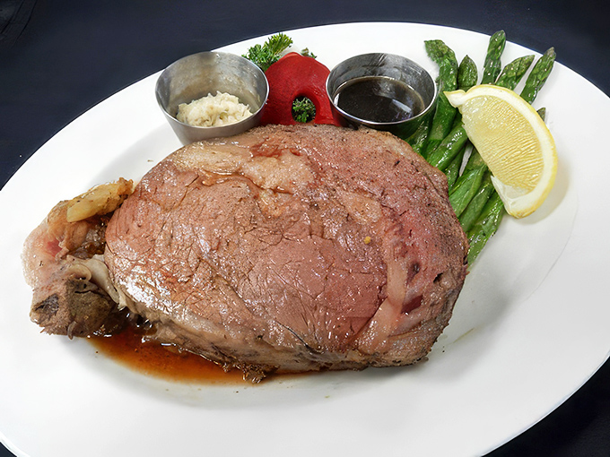 Behold the prime rib in all its glory&mdash;perfectly pink, juicy, and surrounded by sides that know their supporting role in this meaty masterpiece.