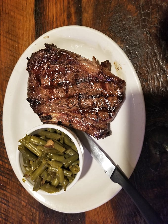 Not all heroes wear capes—some arrive on white plates with a side of green beans, like this perfectly seared steak that's about to make someone's day.