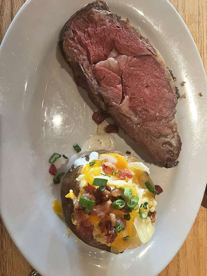 This prime rib doesn't just melt in your mouth&mdash;it stages a full-blown flavor carnival there, while its loaded baked potato sidekick steals scenes on the side.