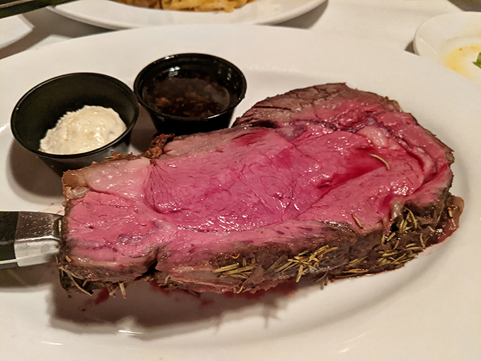 Prime rib so perfectly pink it could make a vegetarian question their life choices. Those little cups of horseradish and au jus? Non-negotiable companions.