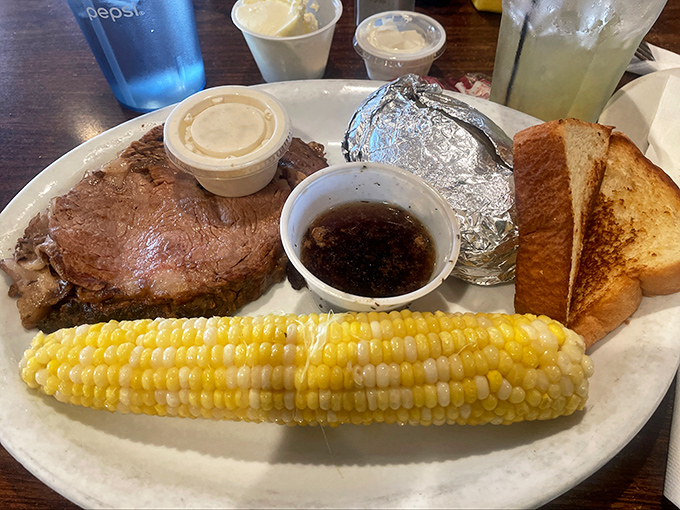 A prime rib that doesn't need fancy plating to impress, served with corn so yellow it practically sings summer's greatest hits.
