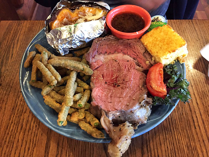 Prime rib so perfectly cooked it should have its own Instagram account. That baked potato in foil? The unsung sidekick of this meaty masterpiece.