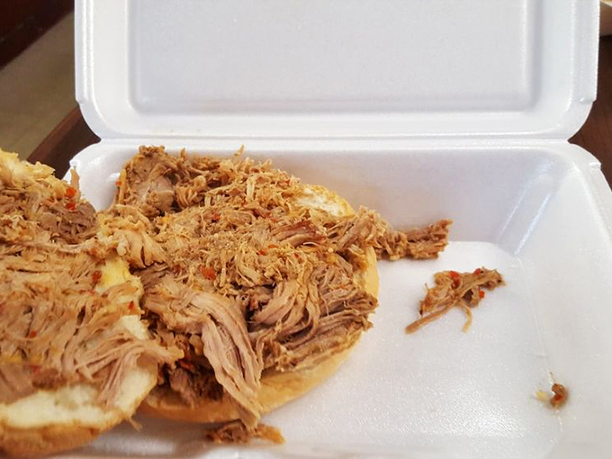 Behold, the pulled pork in its natural habitat&mdash;tender strands of smoky goodness that make you question why you've wasted time eating anything else.