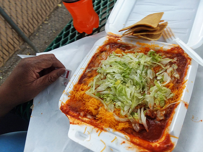 Layer upon layer of red chile sauce, cheese, and fresh lettuce create an enchilada so vibrant it practically sings mariachi music.