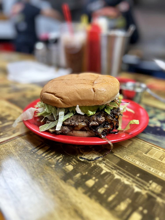 This isn't just a burger; it's an edible monument to simplicity. Fresh lettuce, caramelized beef, and a bun that knows its supporting role.
