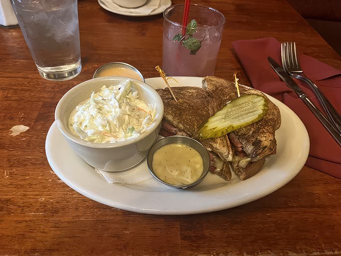 The hero of our story &ndash; a perfectly stacked Reuben that makes other sandwiches question their life choices. That pickle stands guard like a delicious sentinel.