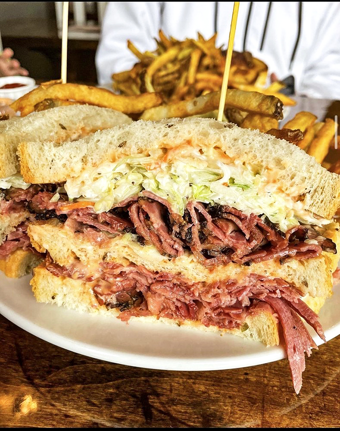 Behold the architectural marvel that is a proper Reuben. The meat-to-bread ratio here would make a Manhattan deli owner weep with pride.