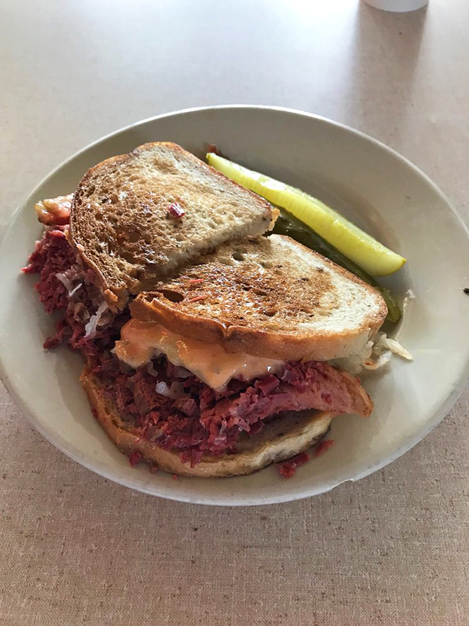 The holy grail of deli sandwiches arrives with a pickle spear companion. This Reuben isn't just a meal, it's a Milwaukee rite of passage.