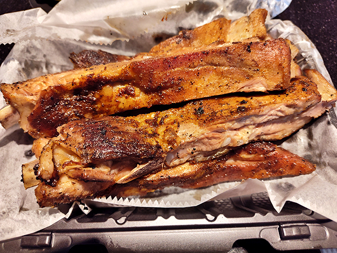 These ribs aren't just falling off the bone; they're practically jumping into your mouth with smoky, spice-crusted enthusiasm.