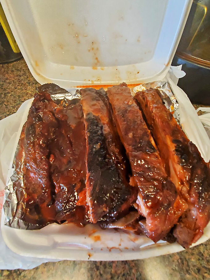 These glistening ribs aren't just food; they're edible evidence that patience, smoke, and tradition create magic. The bark on these beauties would make a lumberjack jealous.