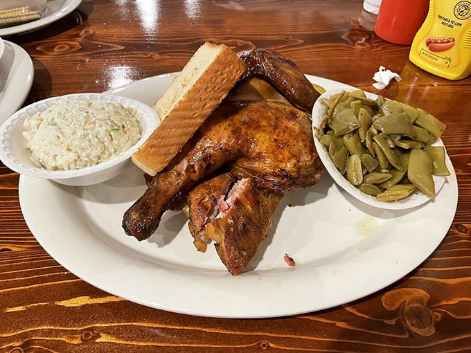 Smoke-kissed chicken that practically winks at you, nestled alongside creamy slaw and green beans that didn't come from any can.