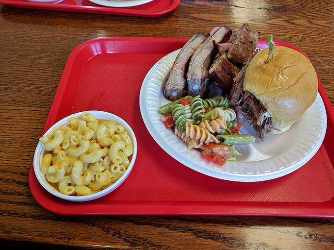 Barbecue plated with honest simplicity. That smoke ring on the ribs tells the whole story&mdash;hours of patient craftsmanship that no fancy presentation could improve upon.