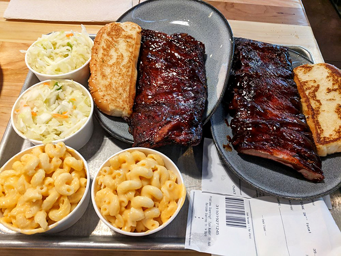 Ribs so glossy they could be in a magazine, flanked by mac and cheese that's clearly living its best life. This isn't a meal, it's a celebration.