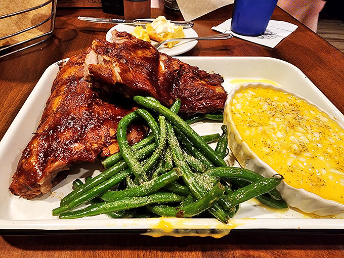Ribs that don't just fall off the bone&mdash;they practically leap into your mouth, accompanied by vibrant green beans and corn pudding that deserves its own fan club.