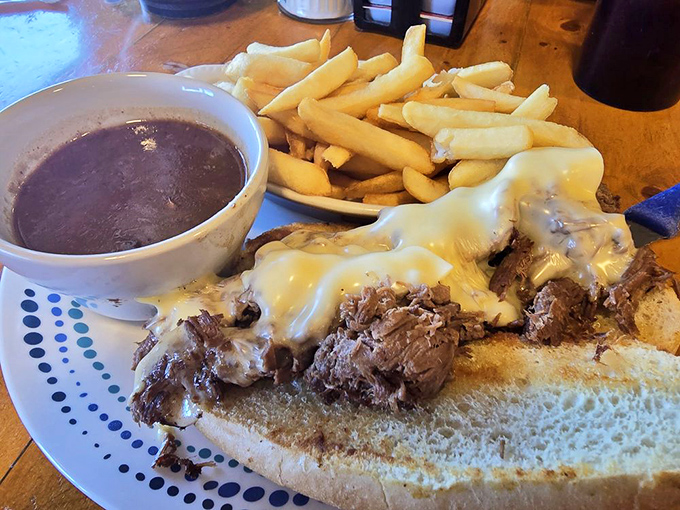 This isn't just a sandwich&mdash;it's a roast beef revelation. Tender meat cascades over bread, with fries standing by for the inevitable gravy dip.