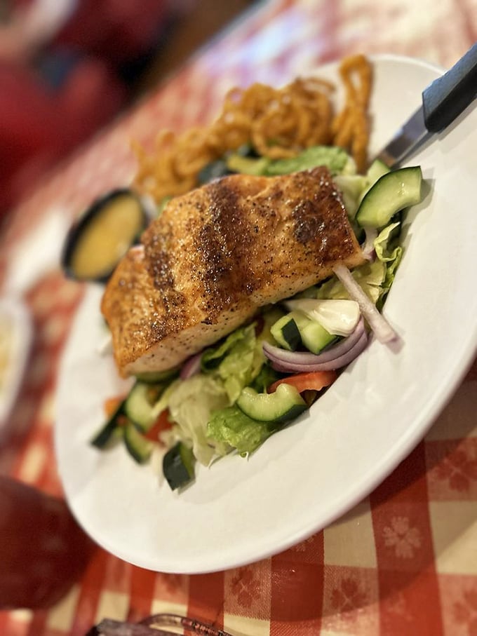 A salmon salad that proves healthy eating doesn't have to be punishment &ndash; fresh greens, perfectly cooked fish, and enough avocado to keep California jealous.