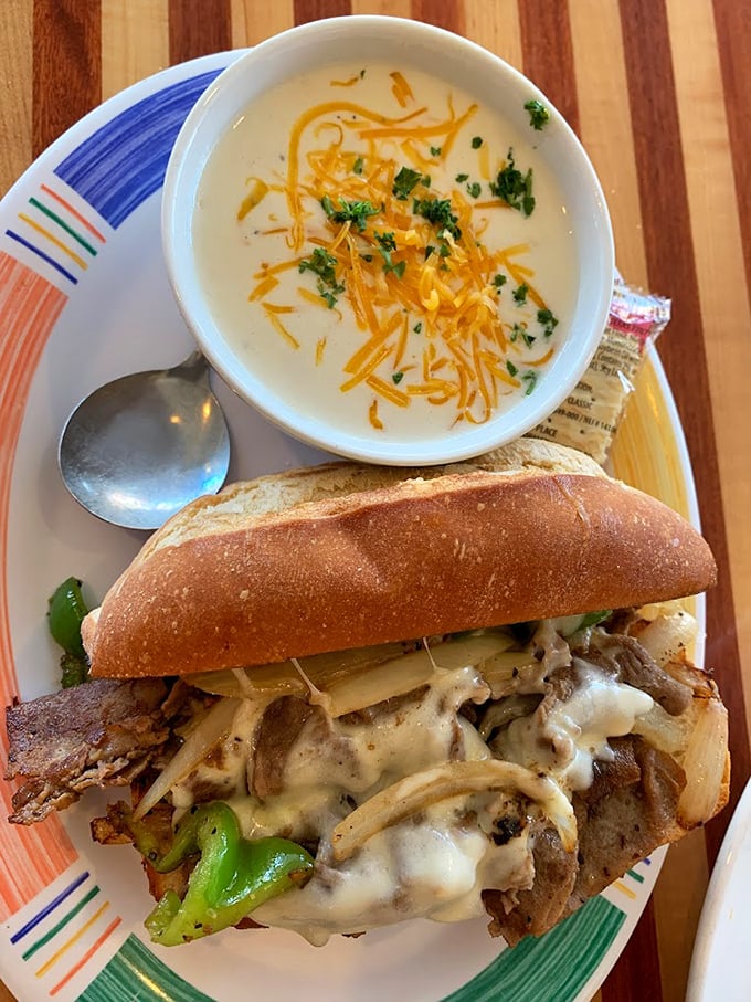 This isn't just a sandwich &ndash; it's architecture with melted cheese. Paired with a creamy soup topped with shredded cheddar, it's comfort food elevated to an art form.
