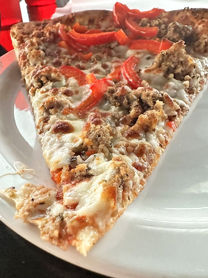 This isn't just pizza&mdash;it's a love letter to perfect proportions. The slightly charred crust cradles melty cheese and savory toppings like a warm hug.