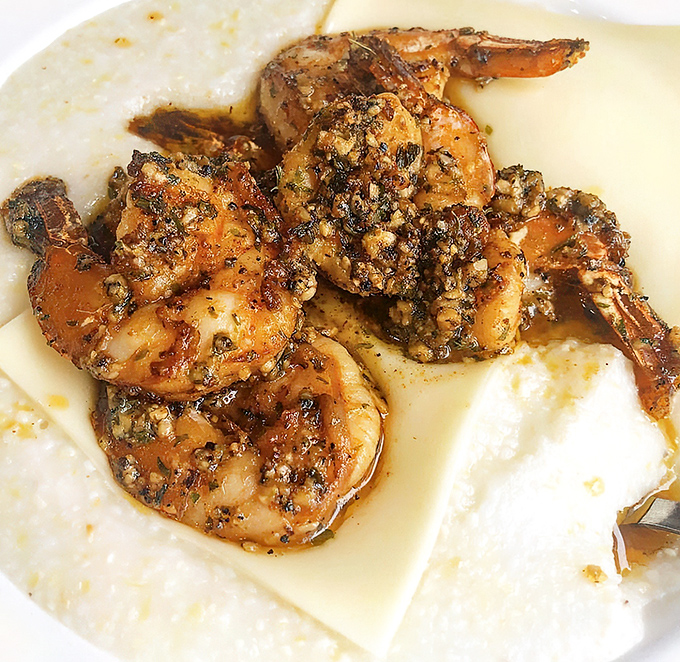 These shrimp and grits aren't just a dish &ndash; they're the reason GPS was invented. "Recalculating route to flavor town."