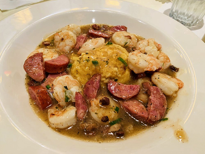 Behold the holy grail of Southern comfort: shrimp and grits swimming in that magical gravy with andouille sausage. Worth crossing county lines for this alone.