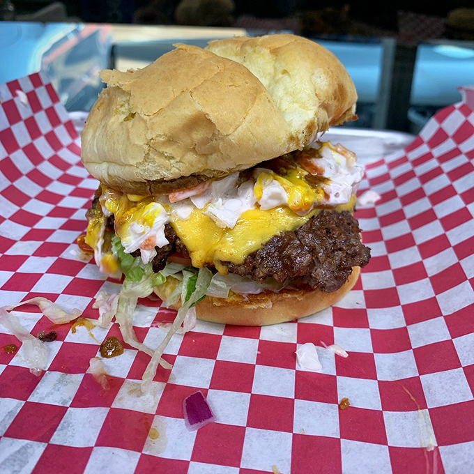 This isn't just a burger&mdash;it's edible architecture. Layers of beef, cheese, and chili creating a masterpiece that demands to be devoured.