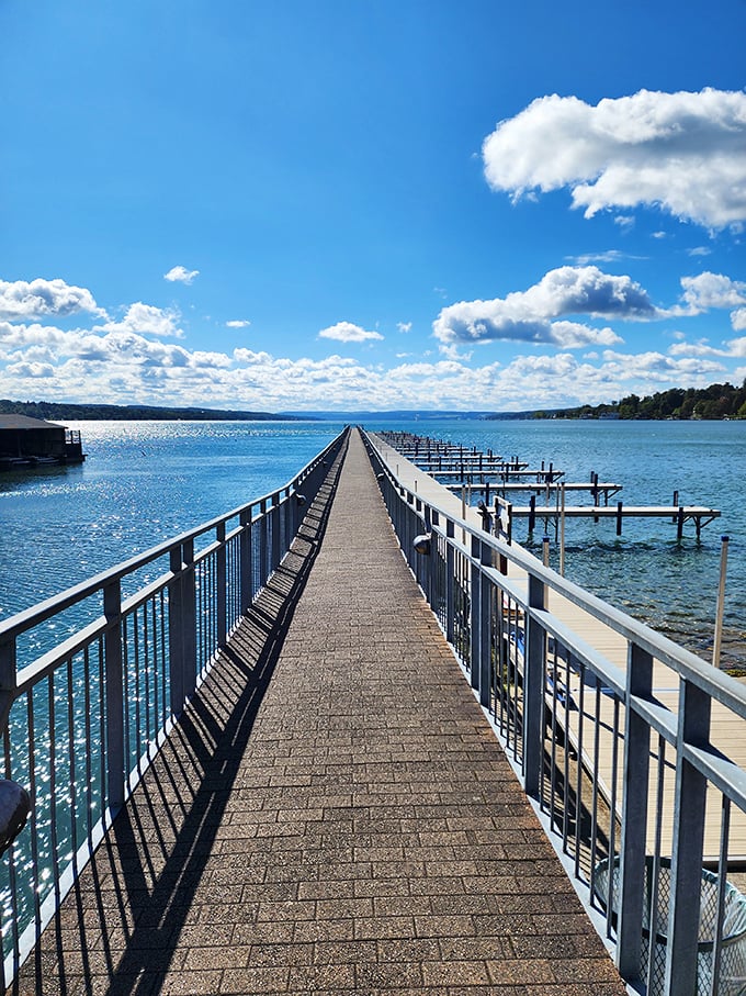 The pier stretches into infinity, daring you to walk its length. Like a runway model showing off Skaneateles Lake's impossibly blue waters.