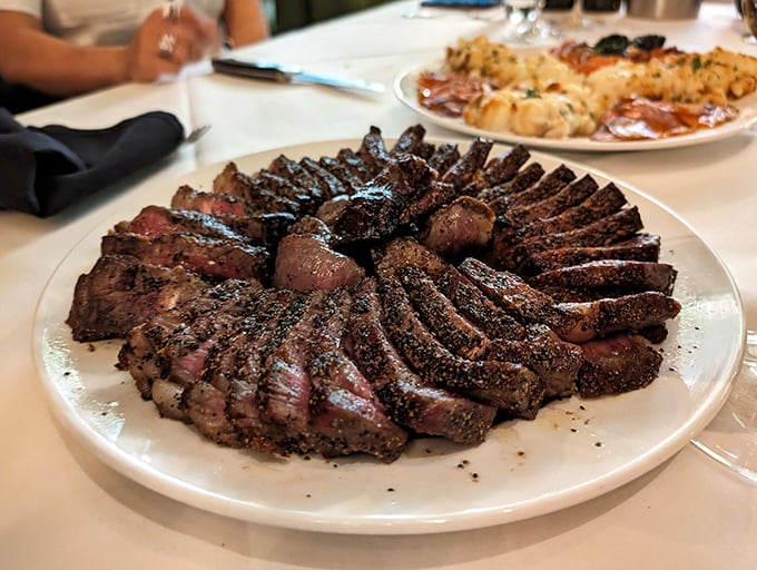 Behold the porterhouse, sliced and displayed like the crown jewels of beef. This isn't just dinner; it's performance art with protein.