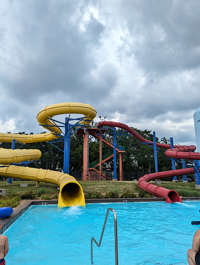 Water slides in competing primary colors stand like modern art installations, except these sculptures deliver you headfirst into refreshing pools with surprising velocity.
