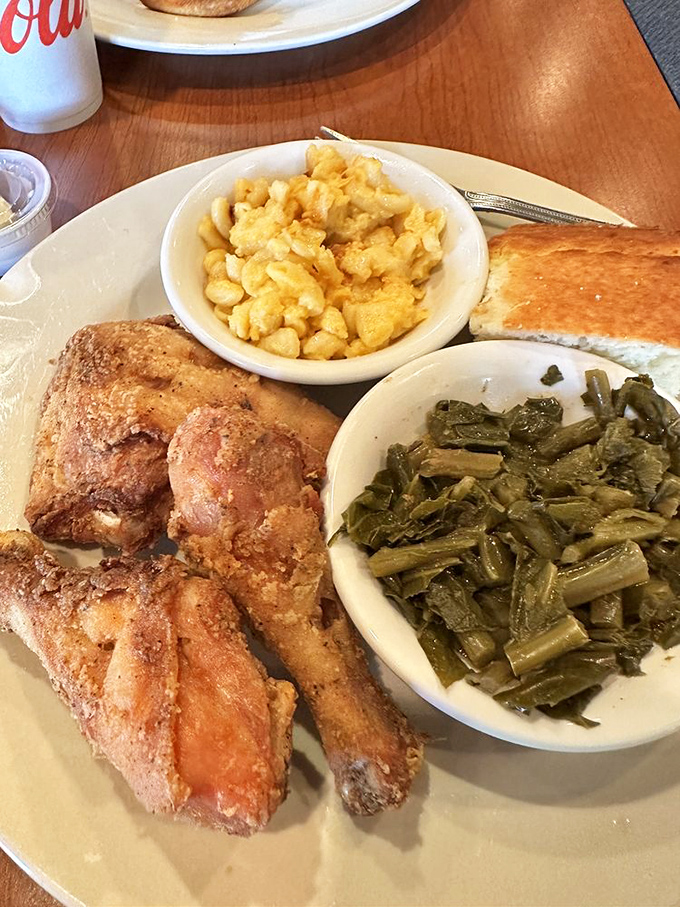 Fried chicken so perfectly golden, it deserves its own trophy. Those collard greens and mac and cheese are no mere supporting actors.