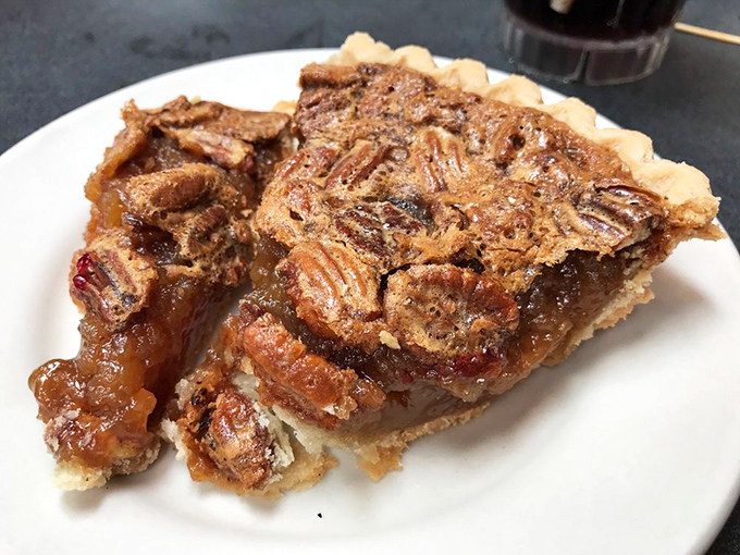 Pecan pie so perfect it belongs in a museum. Those nuts have arranged themselves in a formation that practically whispers, "Go ahead, we dare you to just have one bite."