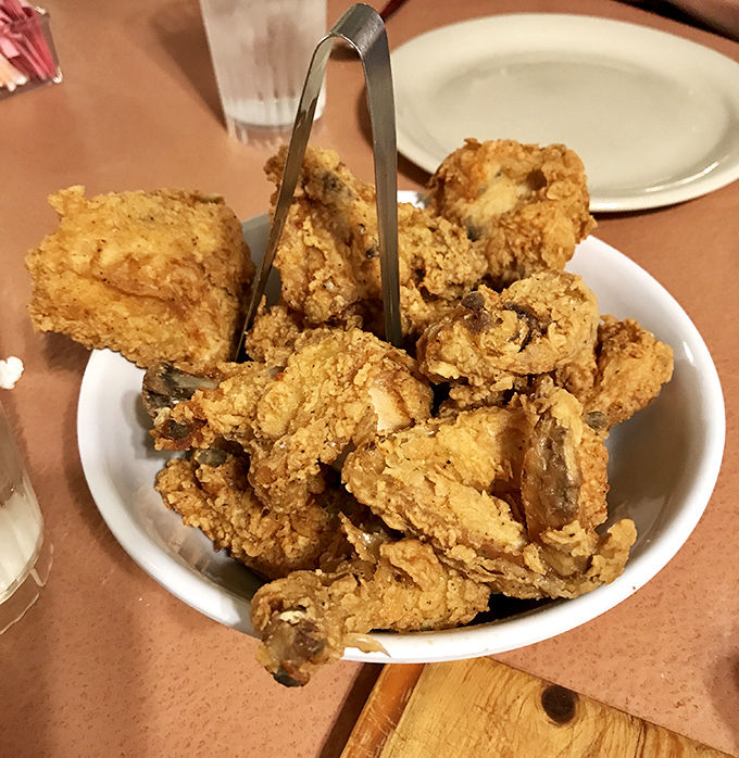 Golden-brown perfection in every bite&mdash;this isn't just fried chicken, it's edible Southern poetry served by the plateful.