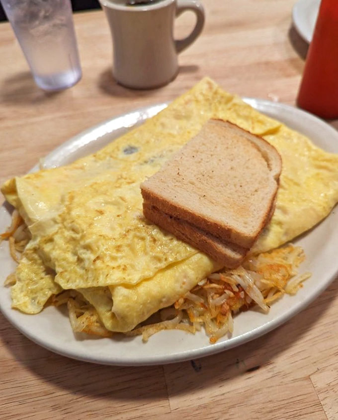 A classic diner breakfast that doesn't need fancy tricks &ndash; just eggs folded to perfection, crispy hashbrowns, and toast that's ready for its supporting role.