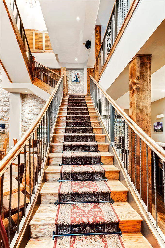 This grand staircase isn't just functional&mdash;it's theatrical. Each step feels like you're ascending through history toward some royal appointment.