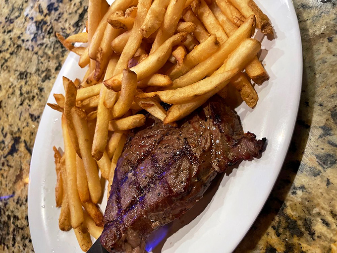 Steak that's more tender than a love song, paired with fries so golden they'd make King Midas jealous. A plate of pure, beefy bliss!