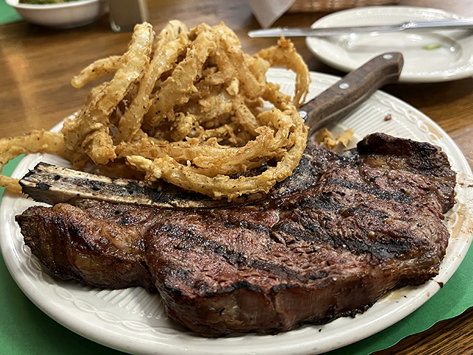 That steak has the kind of char that makes grill masters weep with joy, while those onion rings could double as delicious golden halos.