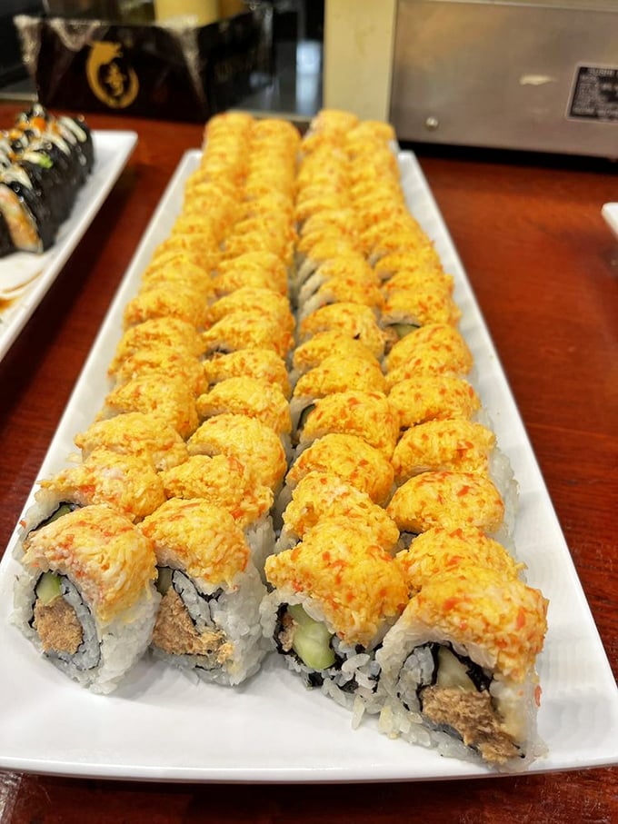 Precision-lined sushi rolls topped with a creamy, spicy mixture that proves buffet sushi doesn't have to be a gamble.