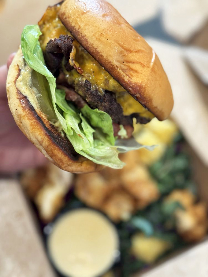 This isn't just a burger; it's edible architecture. The perfect ratio of beef to bun, with fresh lettuce providing that essential crunch.