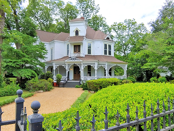 The Hunter House serves Victorian splendor with a side of Southern grace. Those wraparound porches practically beg for a rocking chair and lemonade.