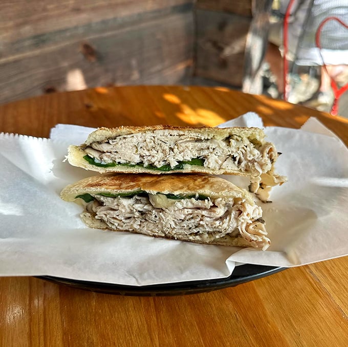 Behold the Tuscan turkey in its natural habitat&mdash;nestled between hearty bread with greens peeking out, practically begging for a bite.