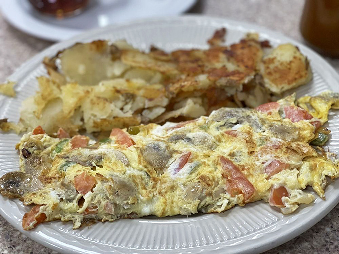 This veggie omelet doesn't apologize for being exactly what it should be: eggs cooked to perfection, stuffed with fresh ingredients, and served without pretension.
