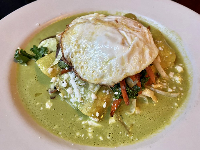 The Verde Enchilada crowned with a perfectly fried egg is what breakfast dreams are made of. That vibrant green sauce could wake up even the most stubborn Monday morning.